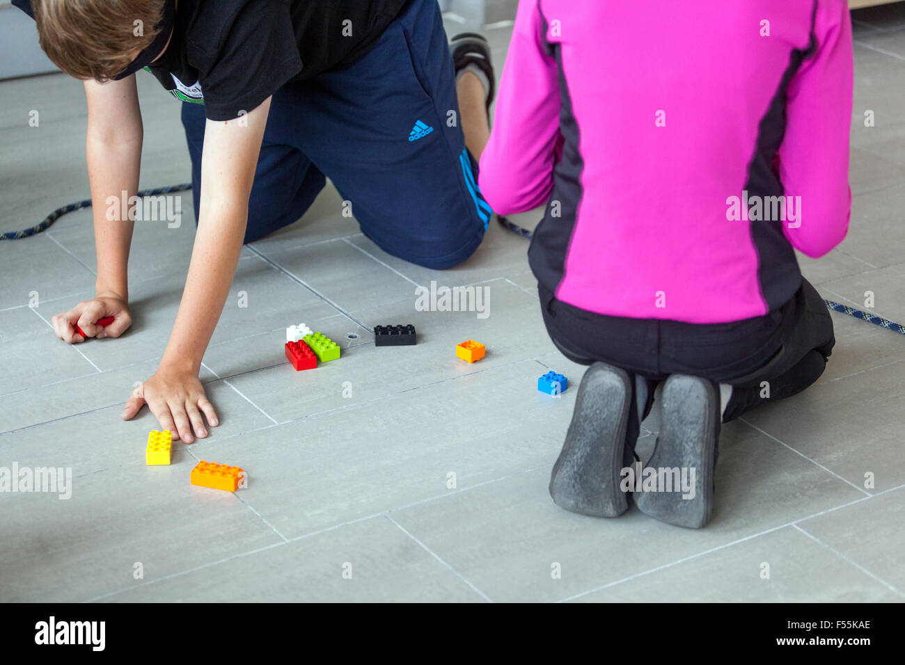 Plastic cubes in the hands of a child's game that develops creativity ...