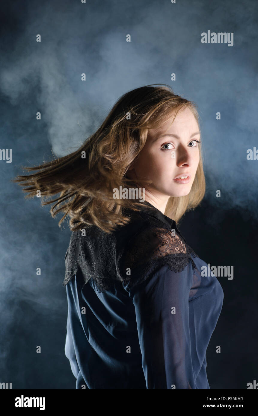 Scared young woman running away in the dark looking back Stock Photo ... Scared young woman running away in the dark looking back Stock Photo ...