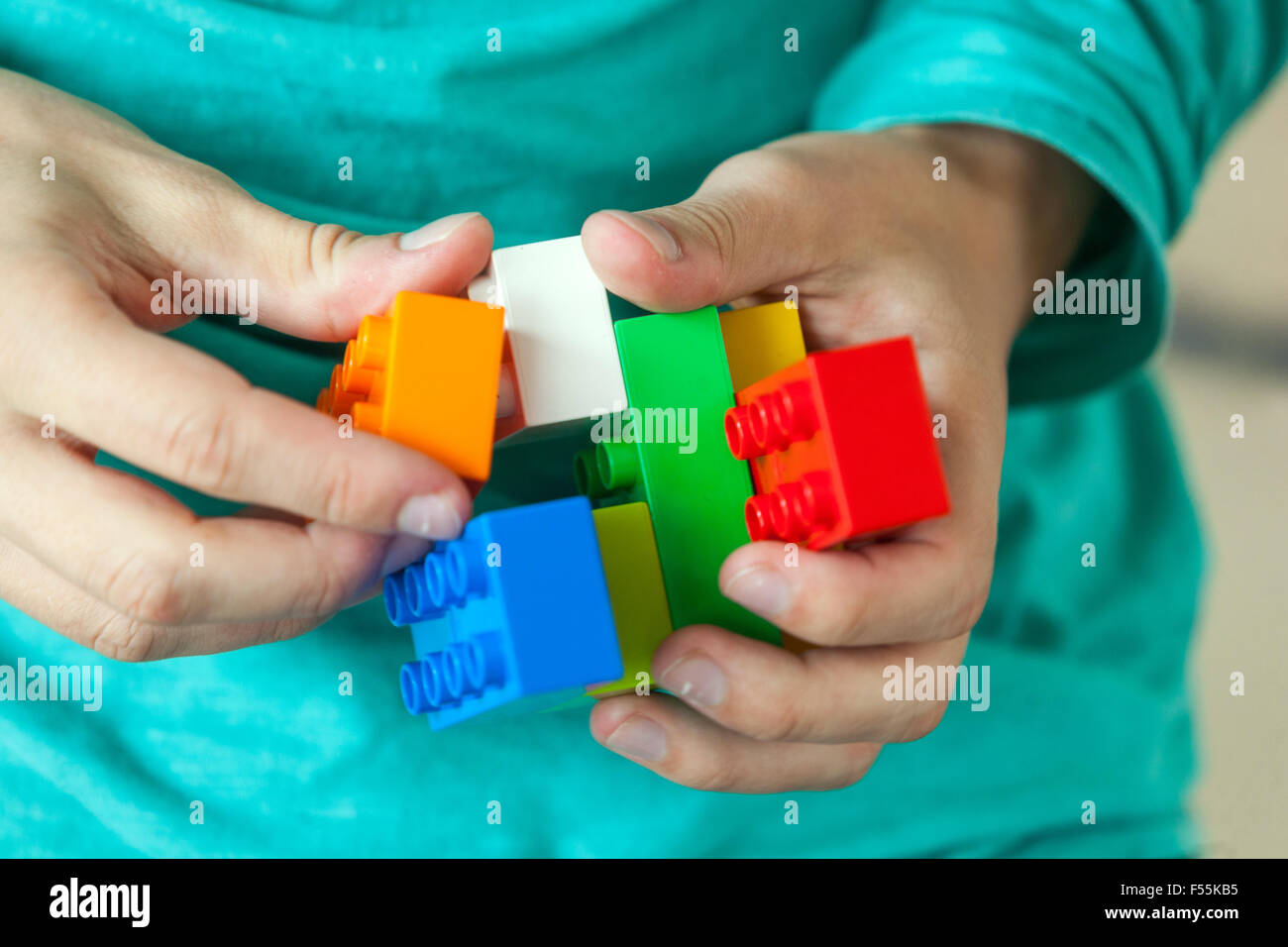 Children hands blocks hi-res stock photography and images - Alamy