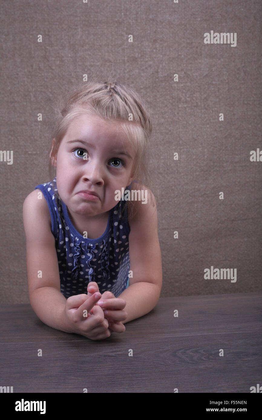 Sad child girl thinking closeup hi-res stock photography and images - Alamy