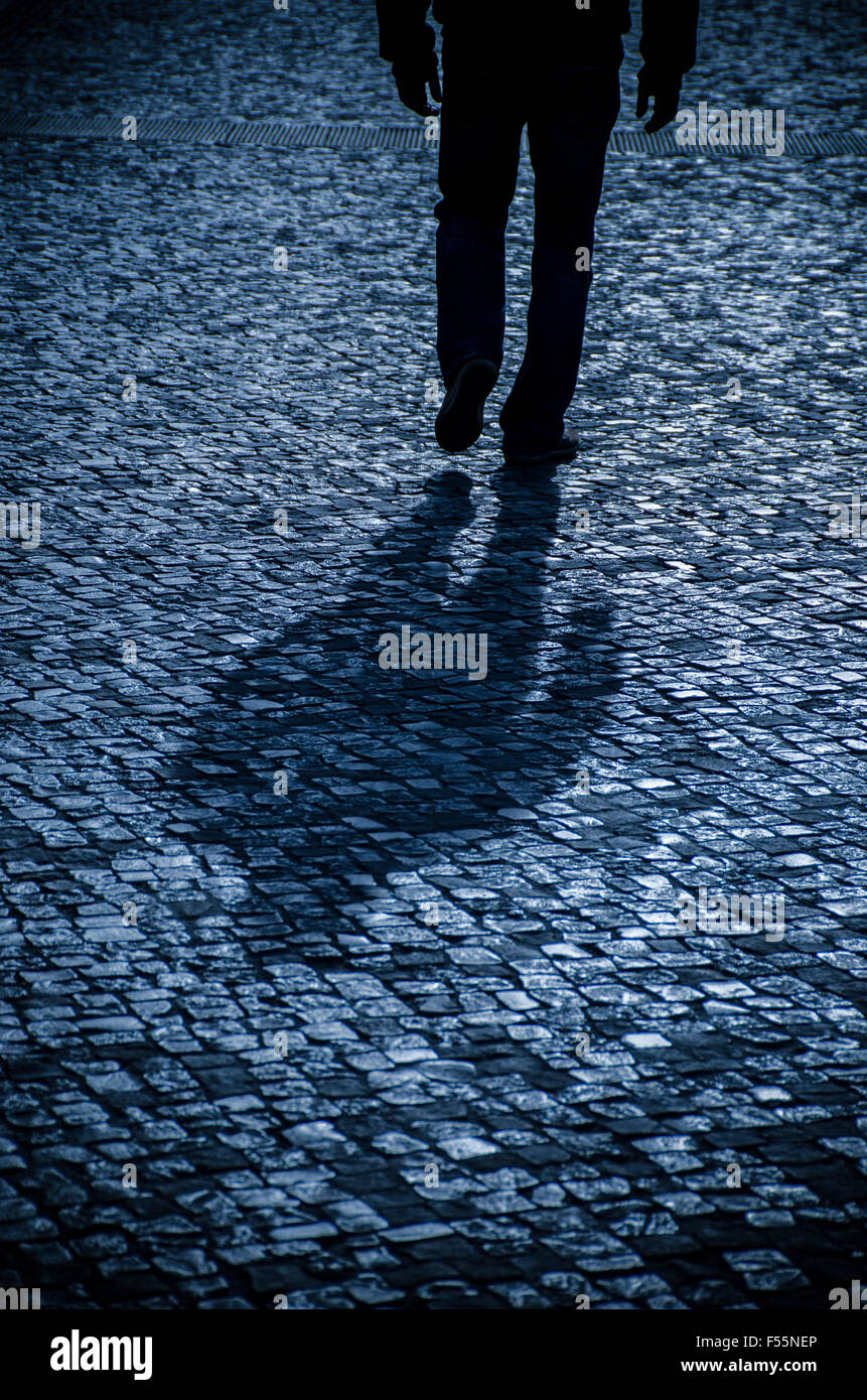 Shadowy man walking hi-res stock photography and images - Alamy