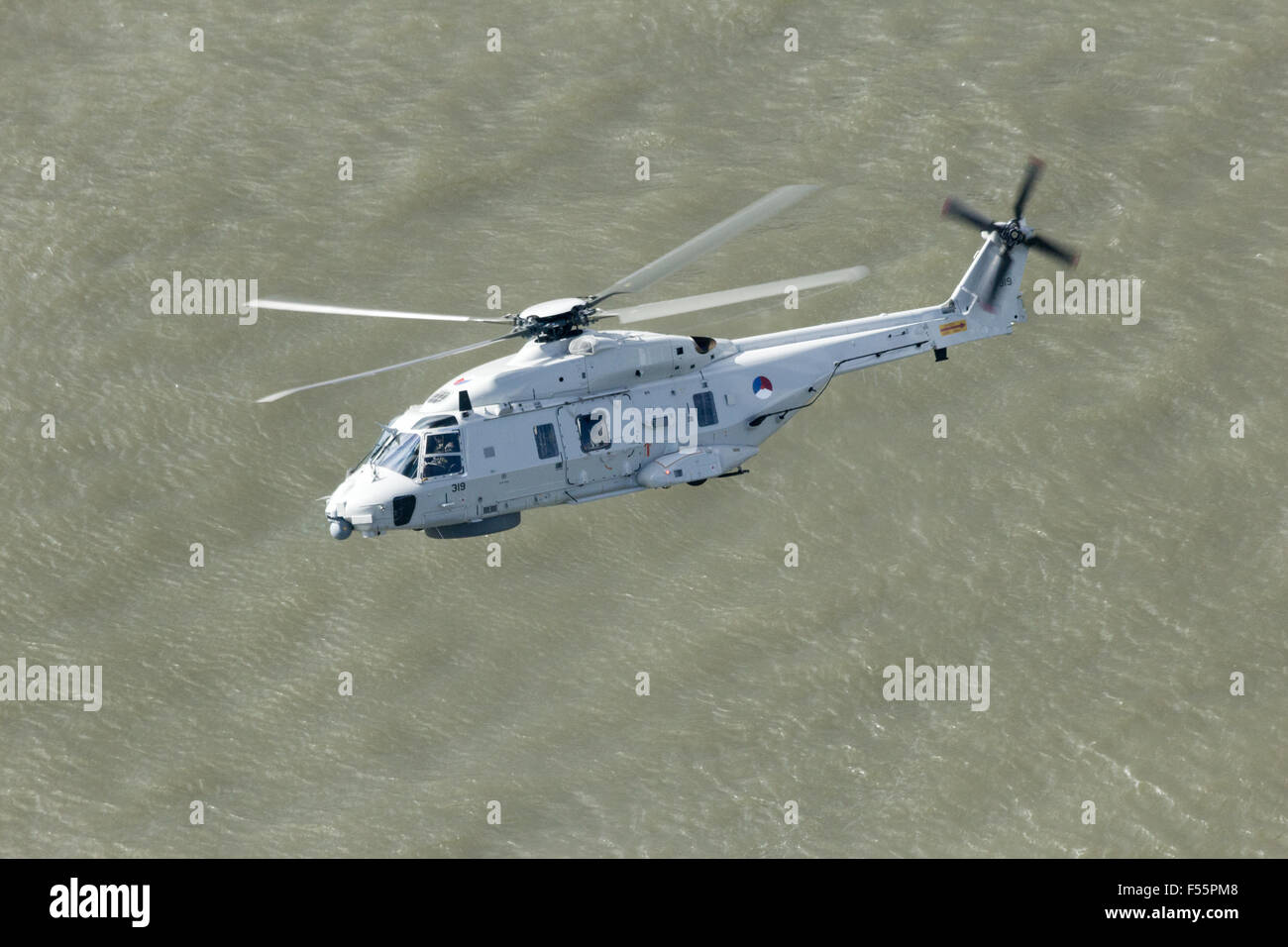 Royal Netherlands Navy NH90 helicopter flying over the Meuse river ...