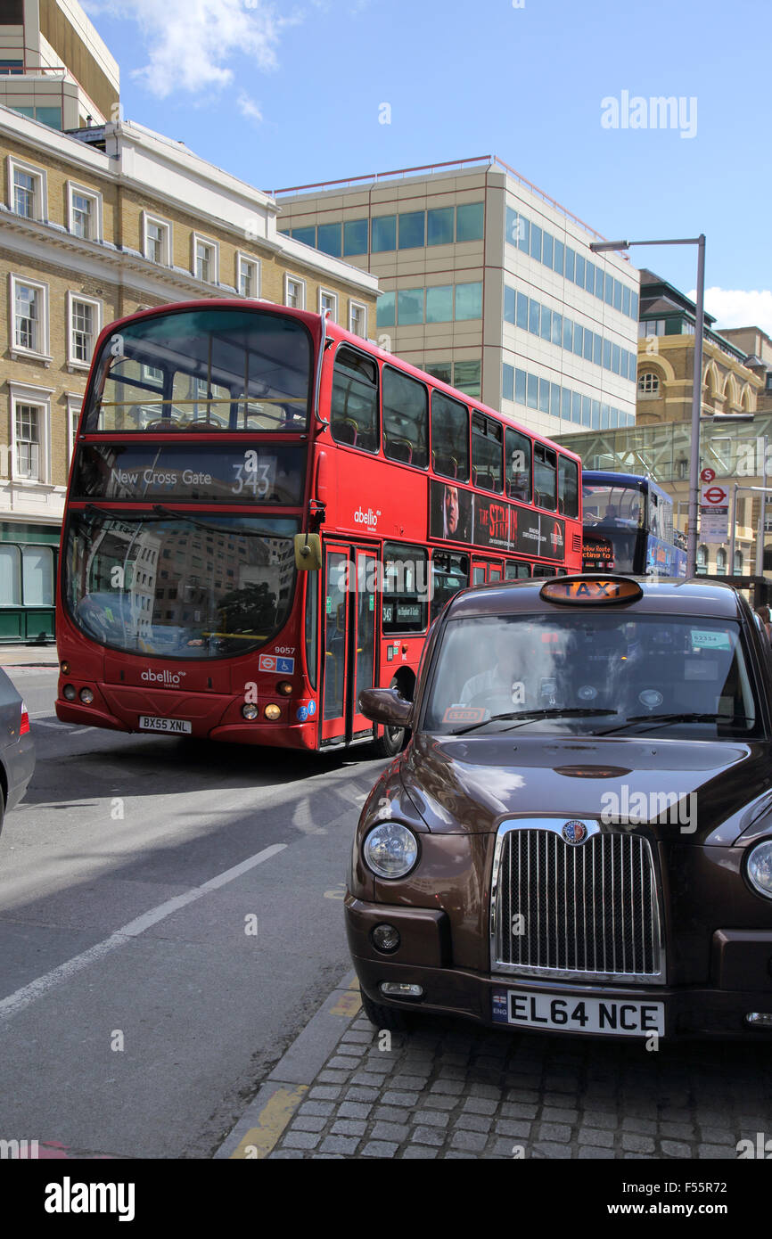 red london bus and black cab in southwark london Stock Photo - Alamy