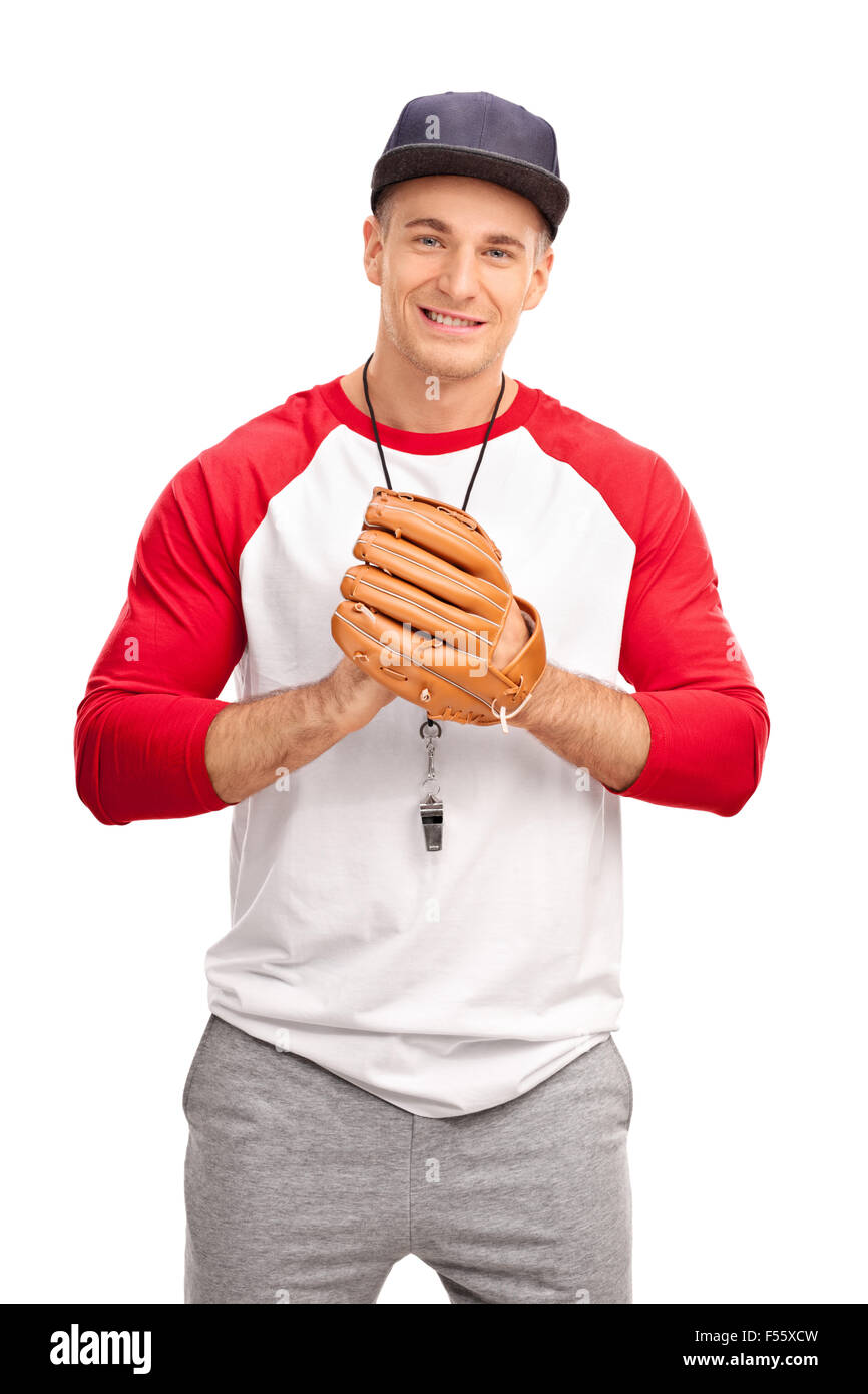 Young baseball coach with a baseball glove looking at the camera ...