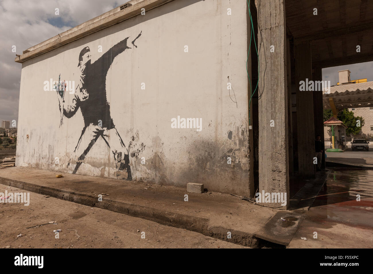 Banksey Graffiti Jerusalem, Man Throwing a Bouquet of Flowers, Rage ...