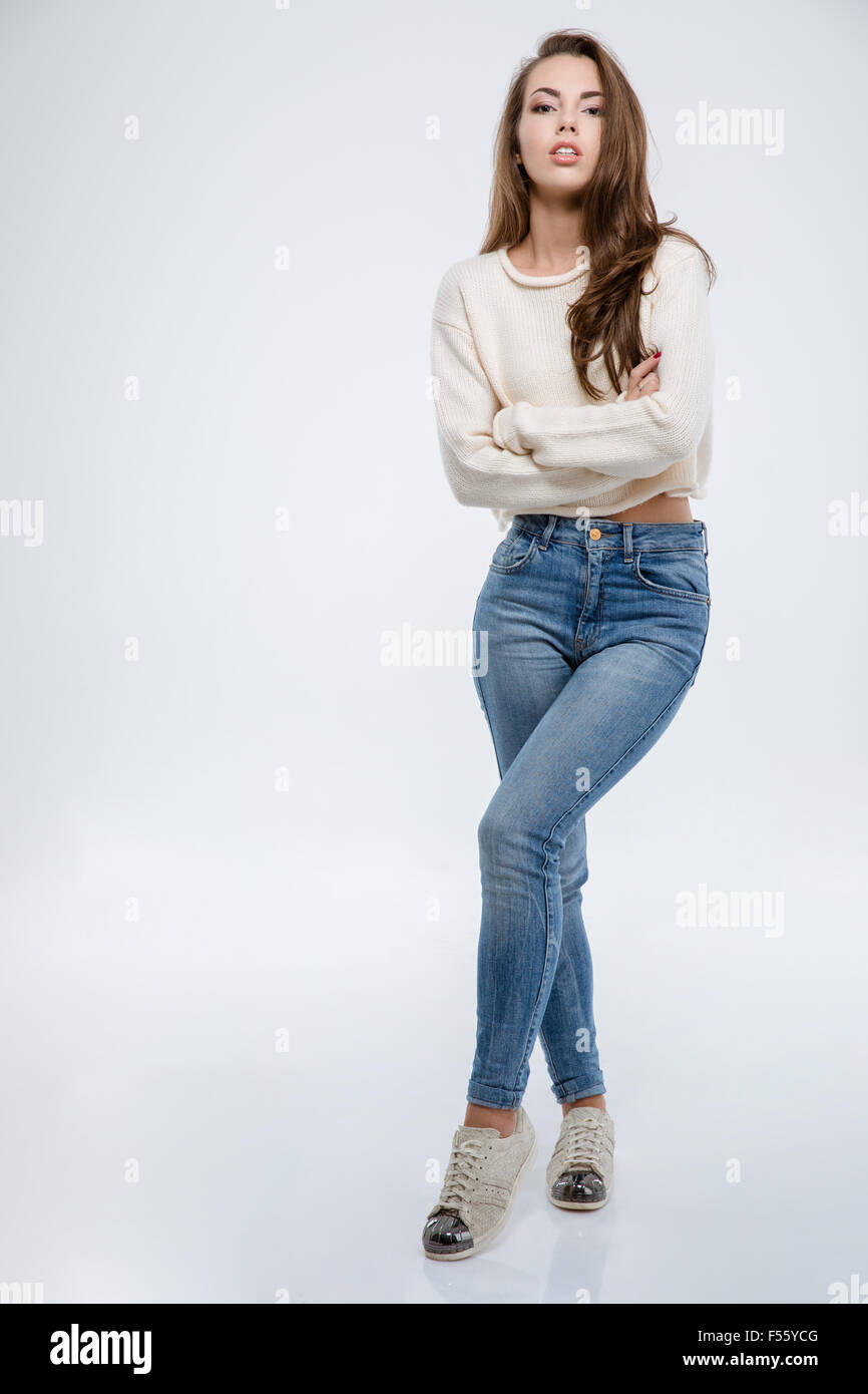Full length portrait of a beautiful casual woman standing with arms ... Full length portrait of a beautiful casual woman standing with arms ...
