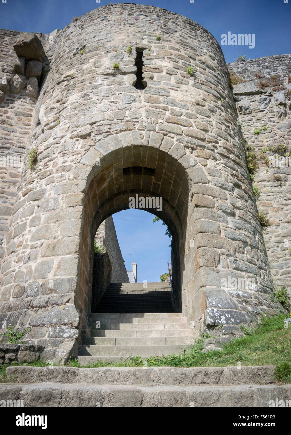 Looking up the steps to the medieval gateway in the city wall of Dinan ...