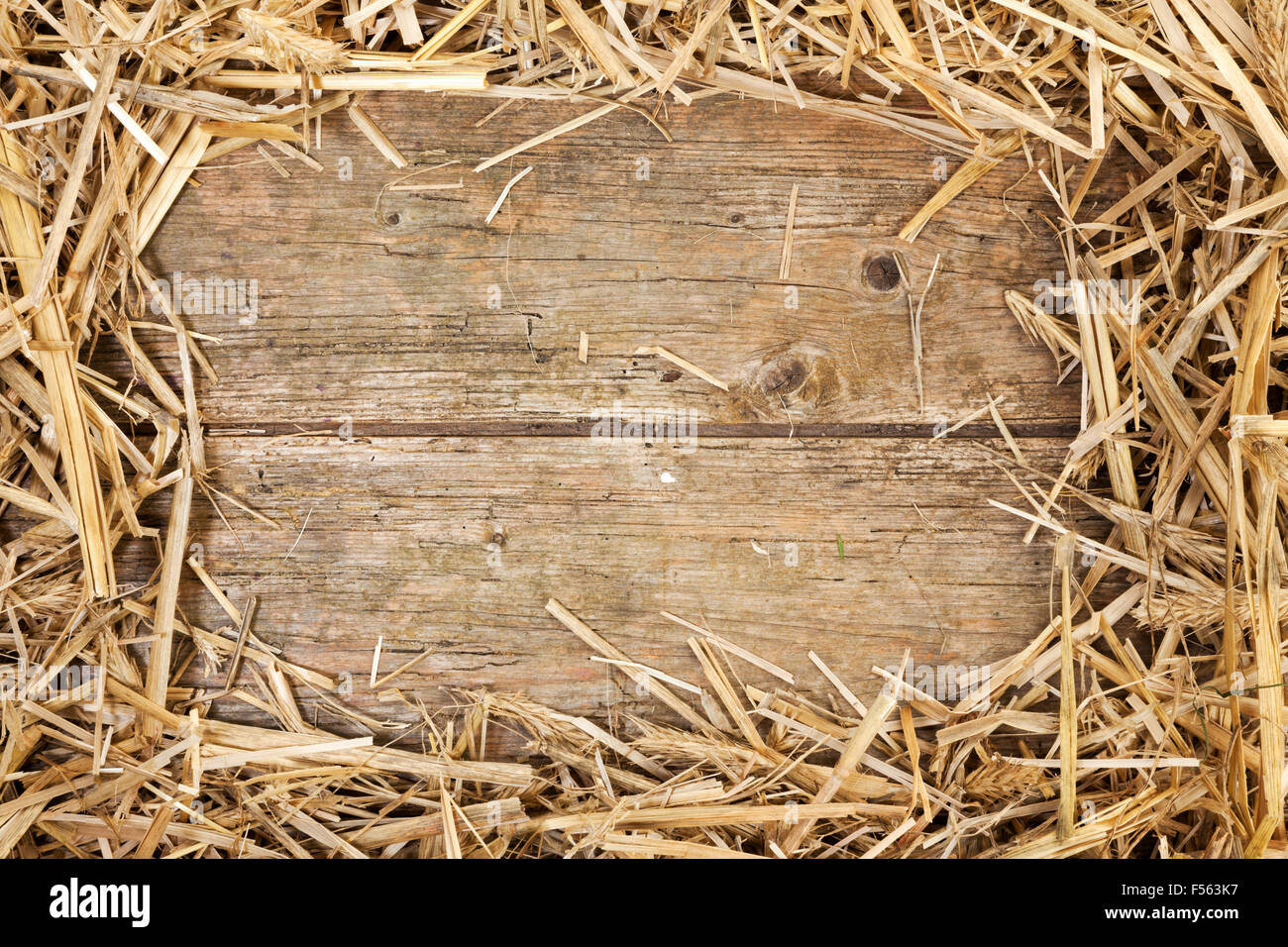 Decorative frame of straw for copy on rustic wooden background Stock ...