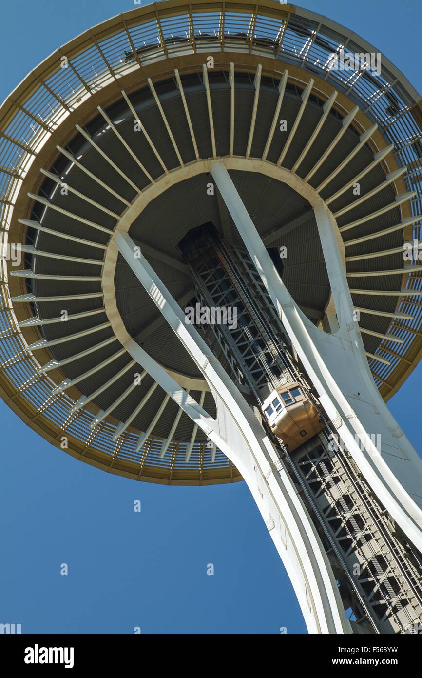 Close up of Space Needle in Seattle with yellow cable car on blue sky ...