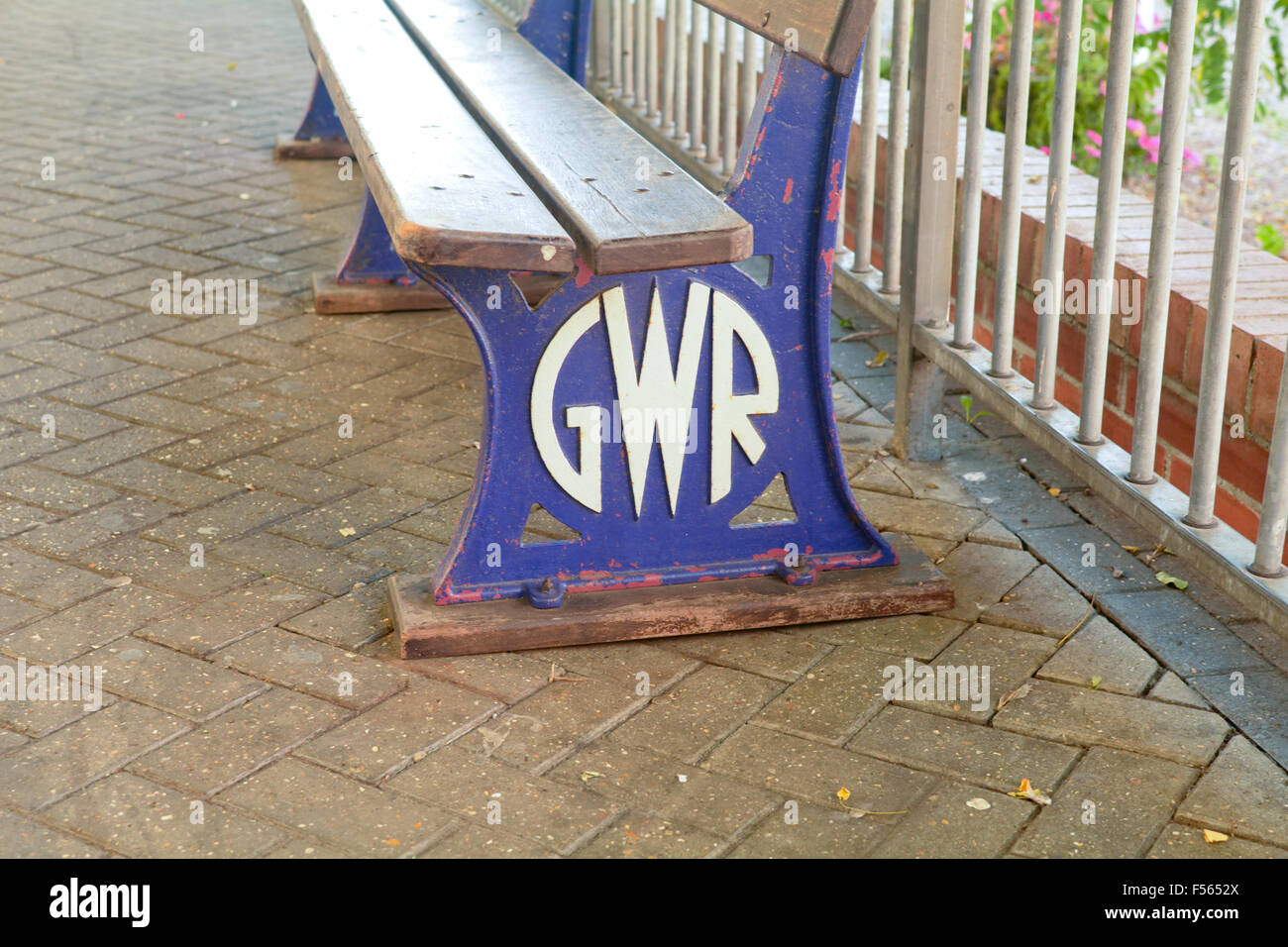 Wooden bench with Great Western Railway logo on platform at Newton ...