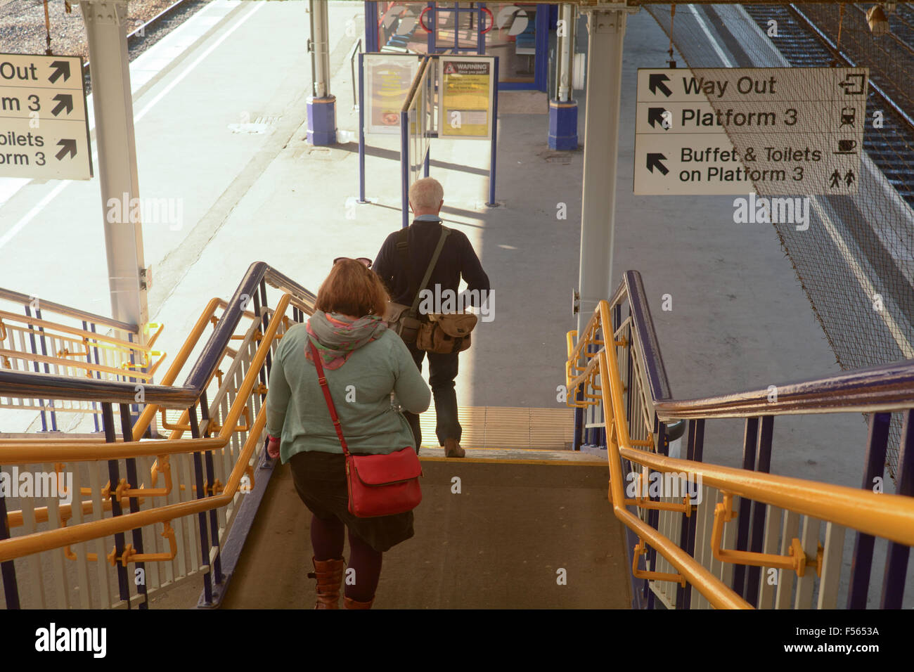 Passengers walking down steps to Platforms 1 and 2 at Newton Abbot ...
