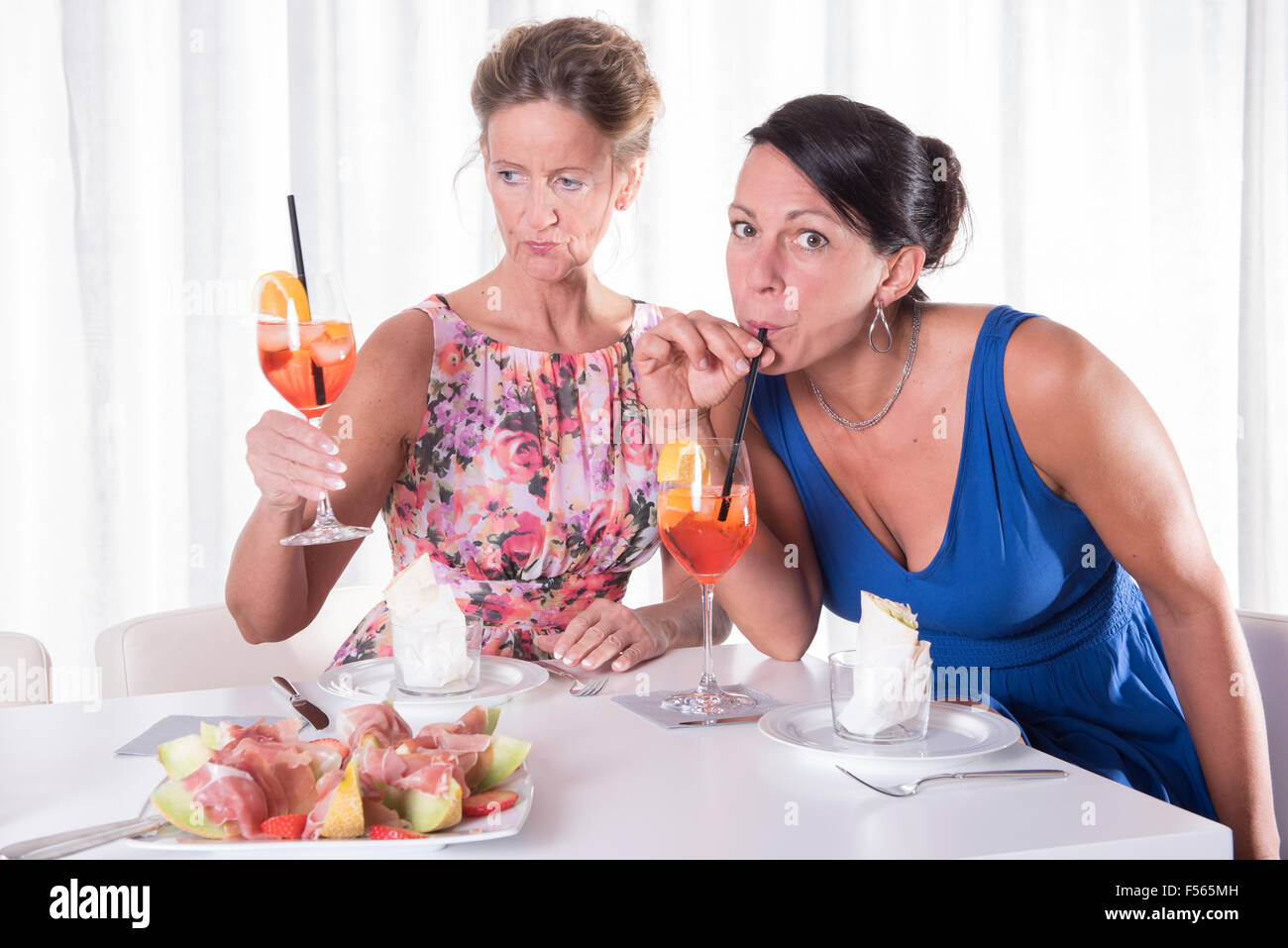 Beautiful woman having dinner hi-res stock photography and images - Alamy