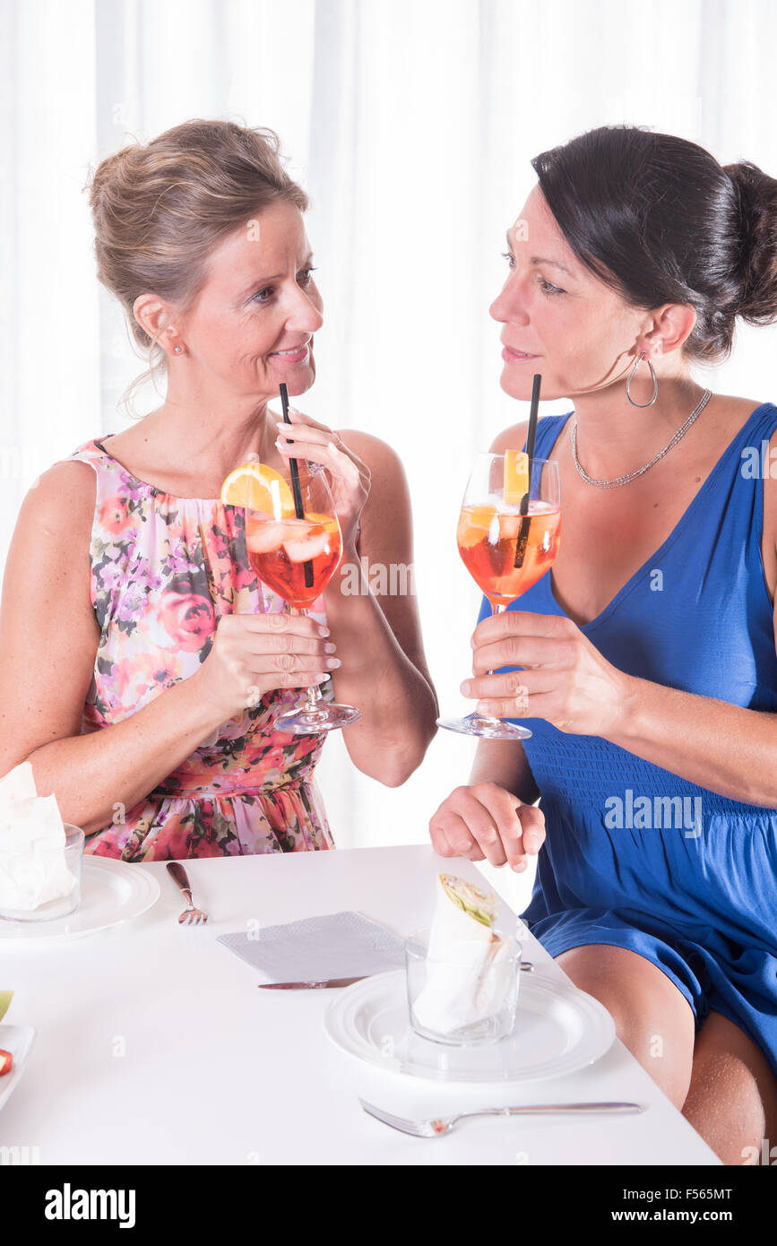 two attractive women having a light dinner Stock Photo - Alamy