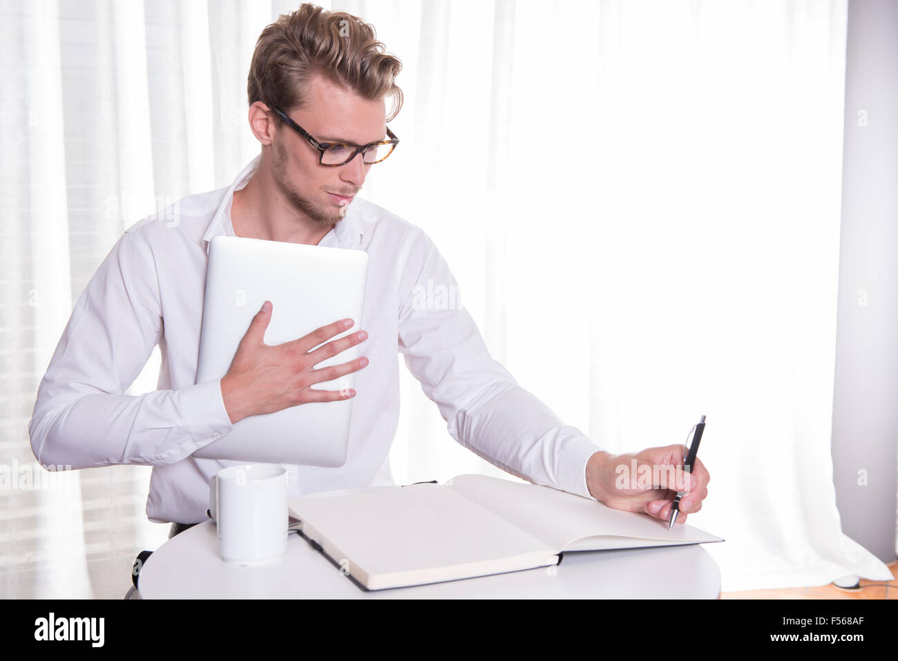 young business man taking notes Stock Photo - Alamy