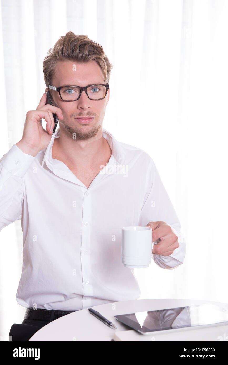 young business man on the phone looking scared Stock Photo - Alamy