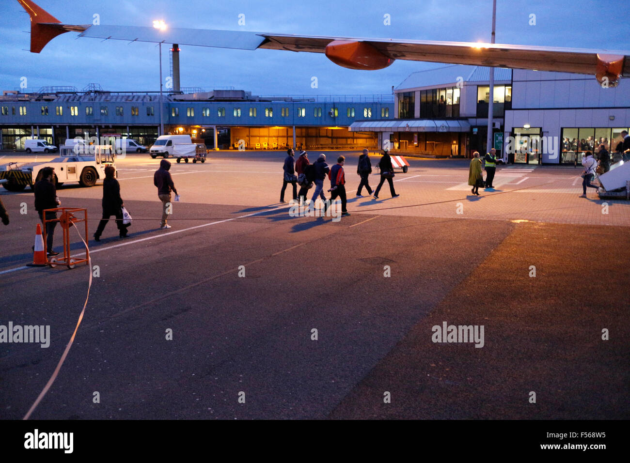 passengers disembarking redeye early morning easyjet flight at belfast ...