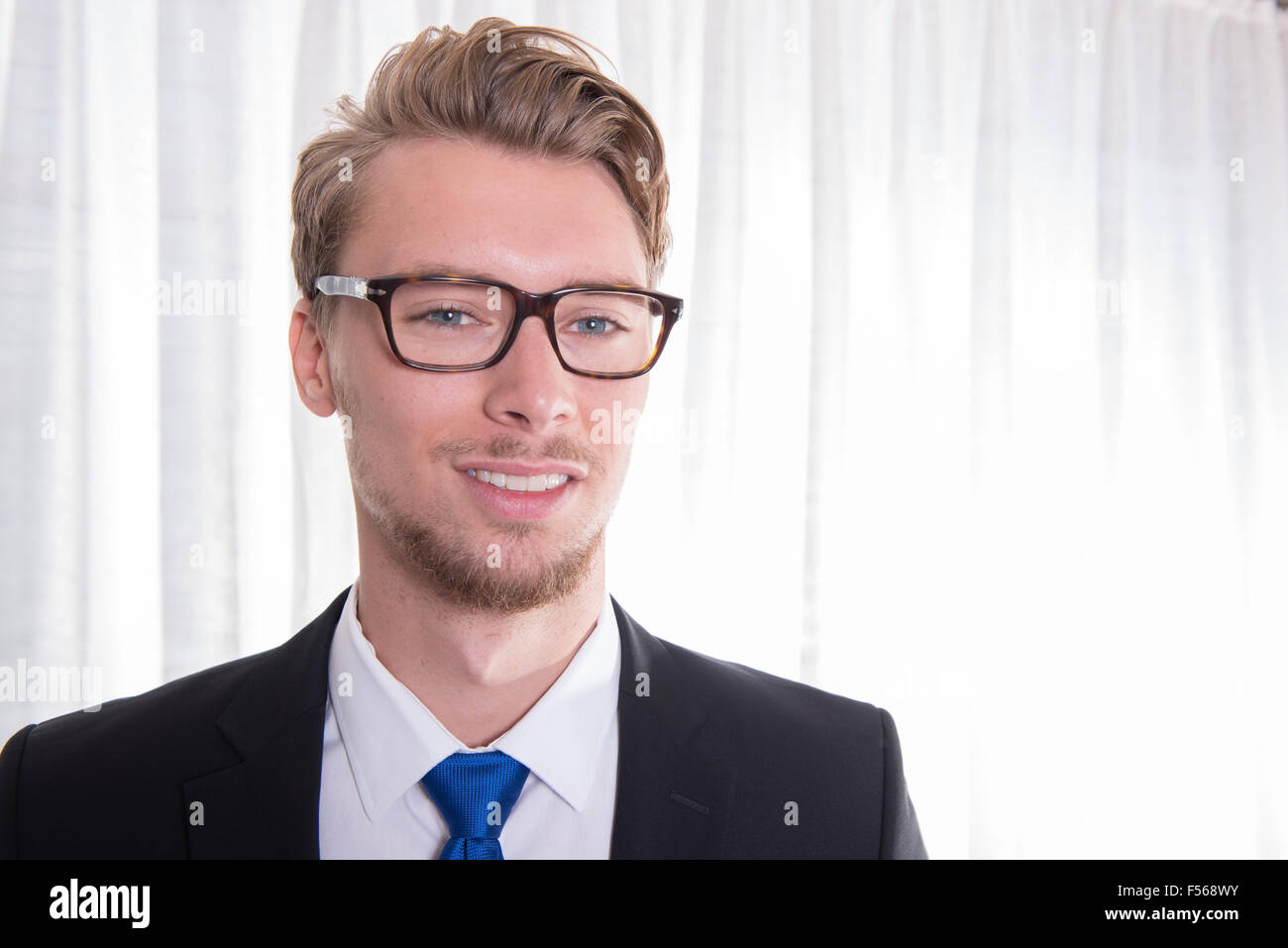 smart young business man in suit and tie Stock Photo - Alamy