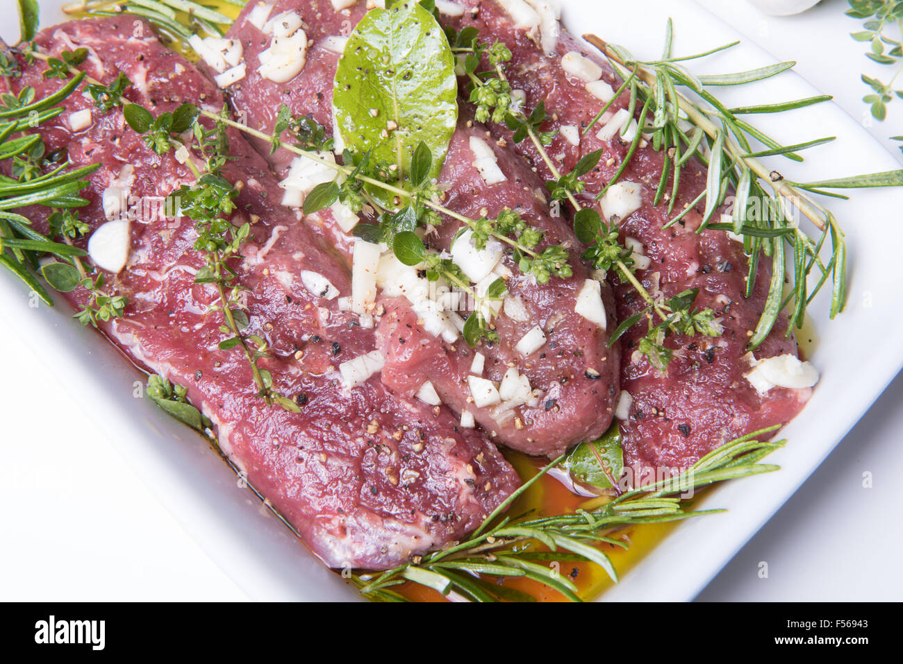 raw lamb fillets with mediteranean herbs Stock Photo - Alamy