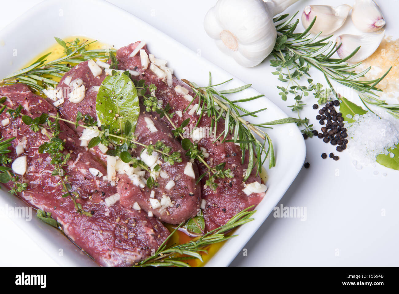 raw lamb fillets with mediteranean herbs Stock Photo - Alamy
