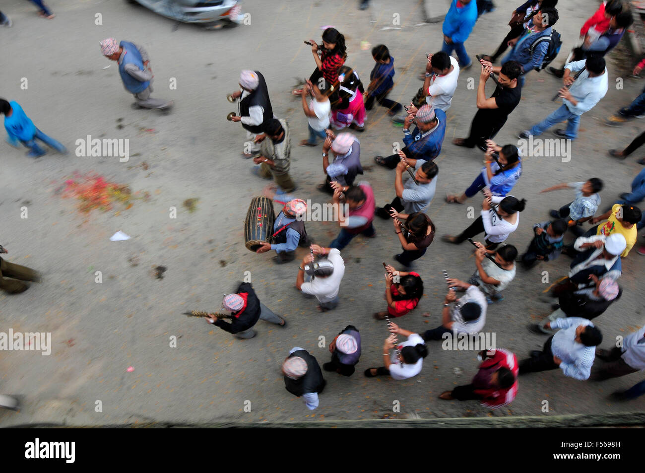 Kathmandu, Nepal. 28th Oct, 2015. Devotees play traditional instruments ...