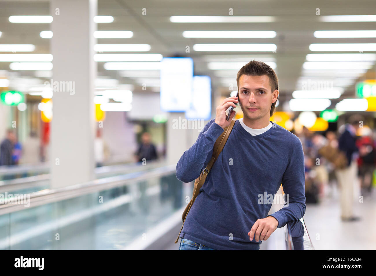 Man holding cell phone boarding hi-res stock photography and images - Alamy