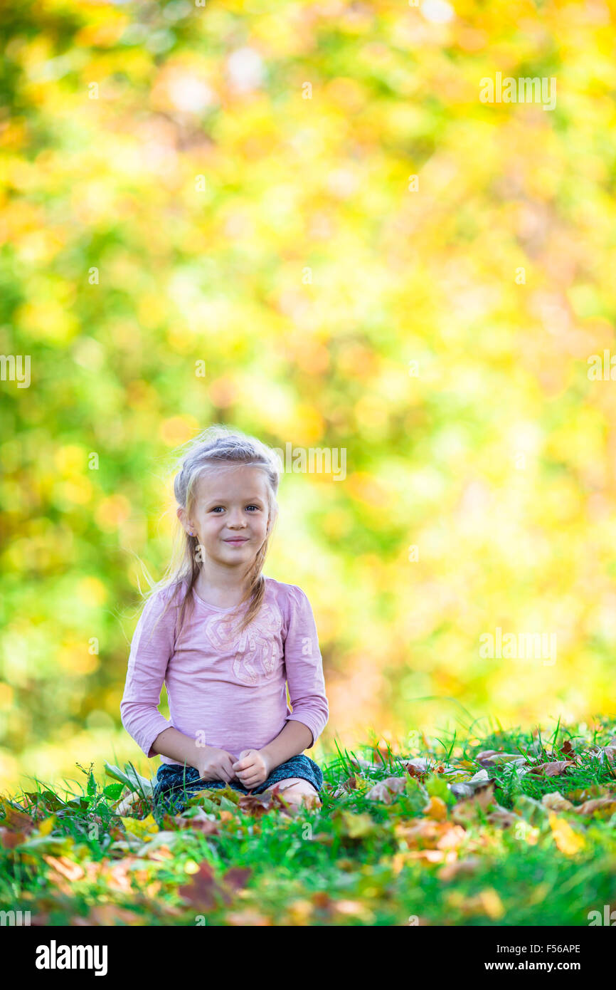 Portrait of little girl at beautiful autumn day outdoors Stock Photo ...