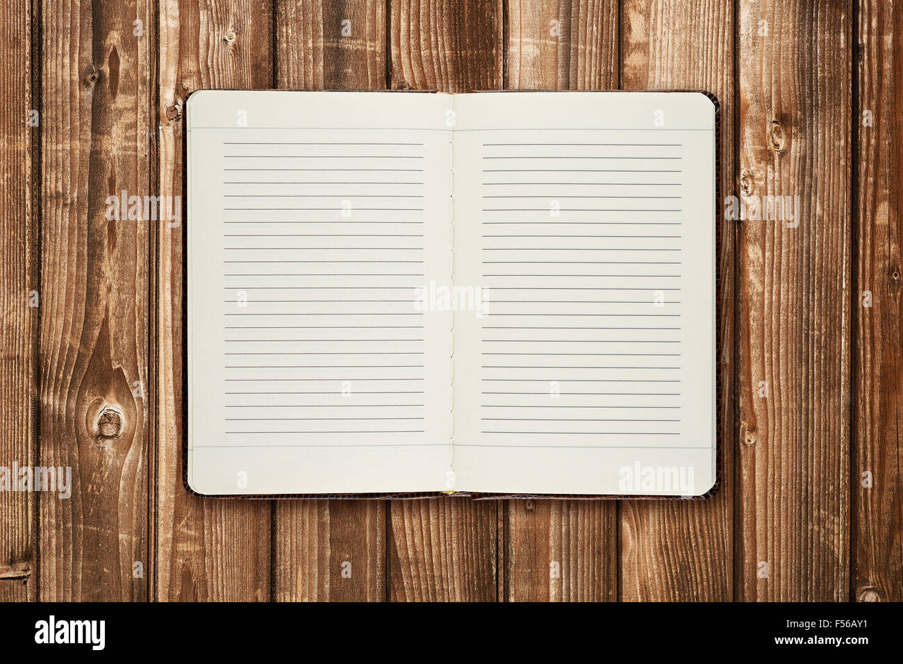 Diary on wooden table Stock Photo - Alamy
