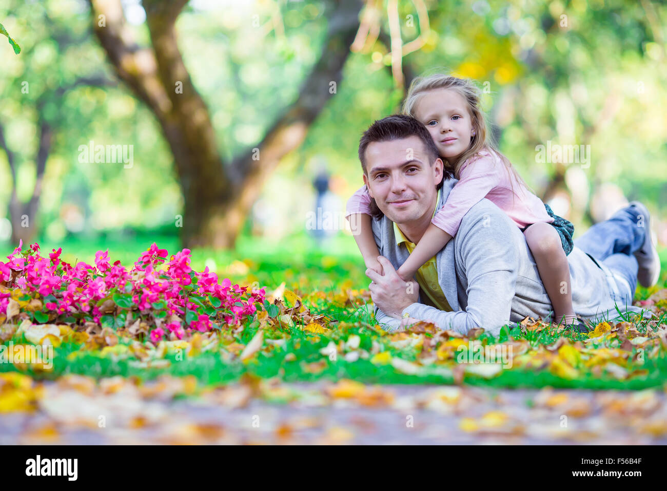 Happy family having fun on beautiful autumn day Stock Photo - Alamy