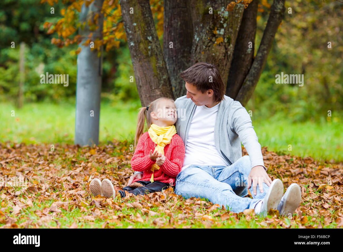 Happy family having fun on beautiful autumn day Stock Photo - Alamy