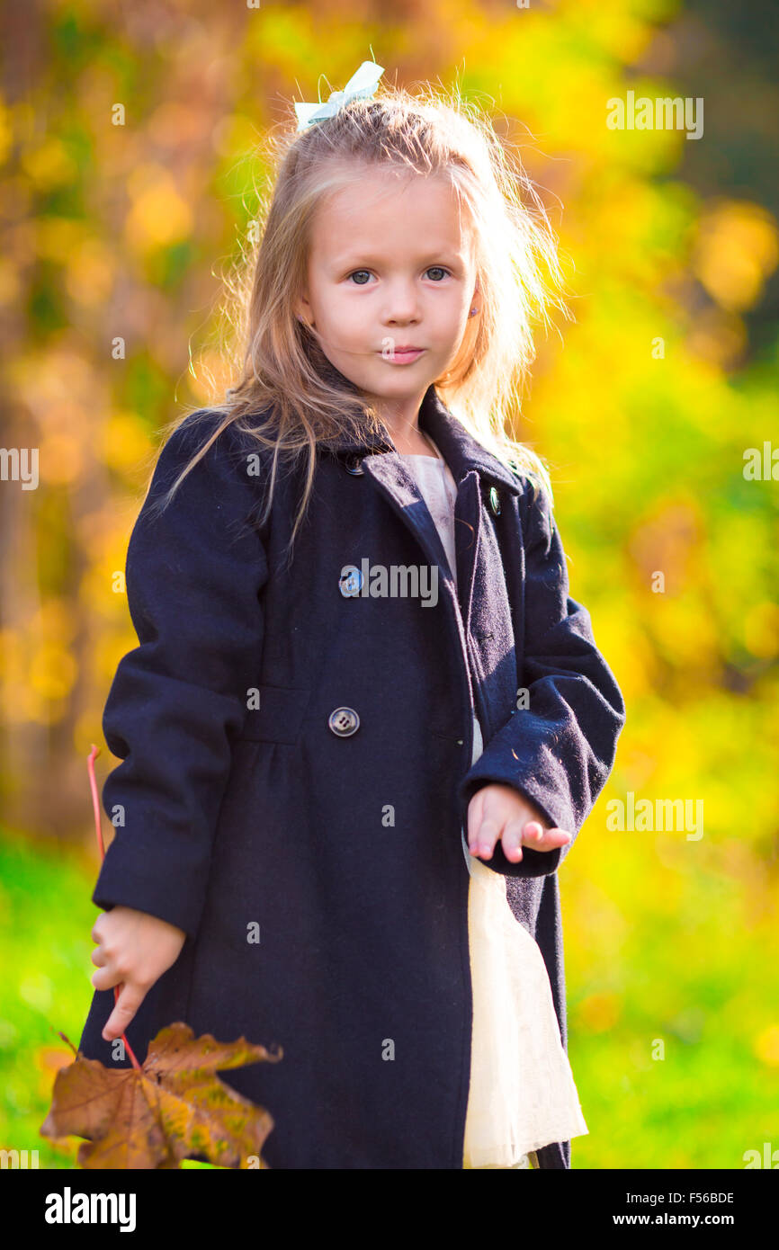 Adorable little girl outdoors at beautiful autumn day Stock Photo - Alamy