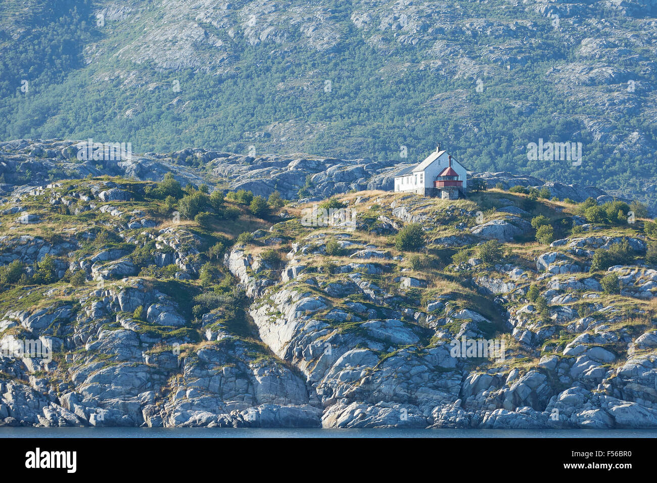 A Vintage Norwegian Lighthouse, Set On The Edge Of A Fjord, North Of ...