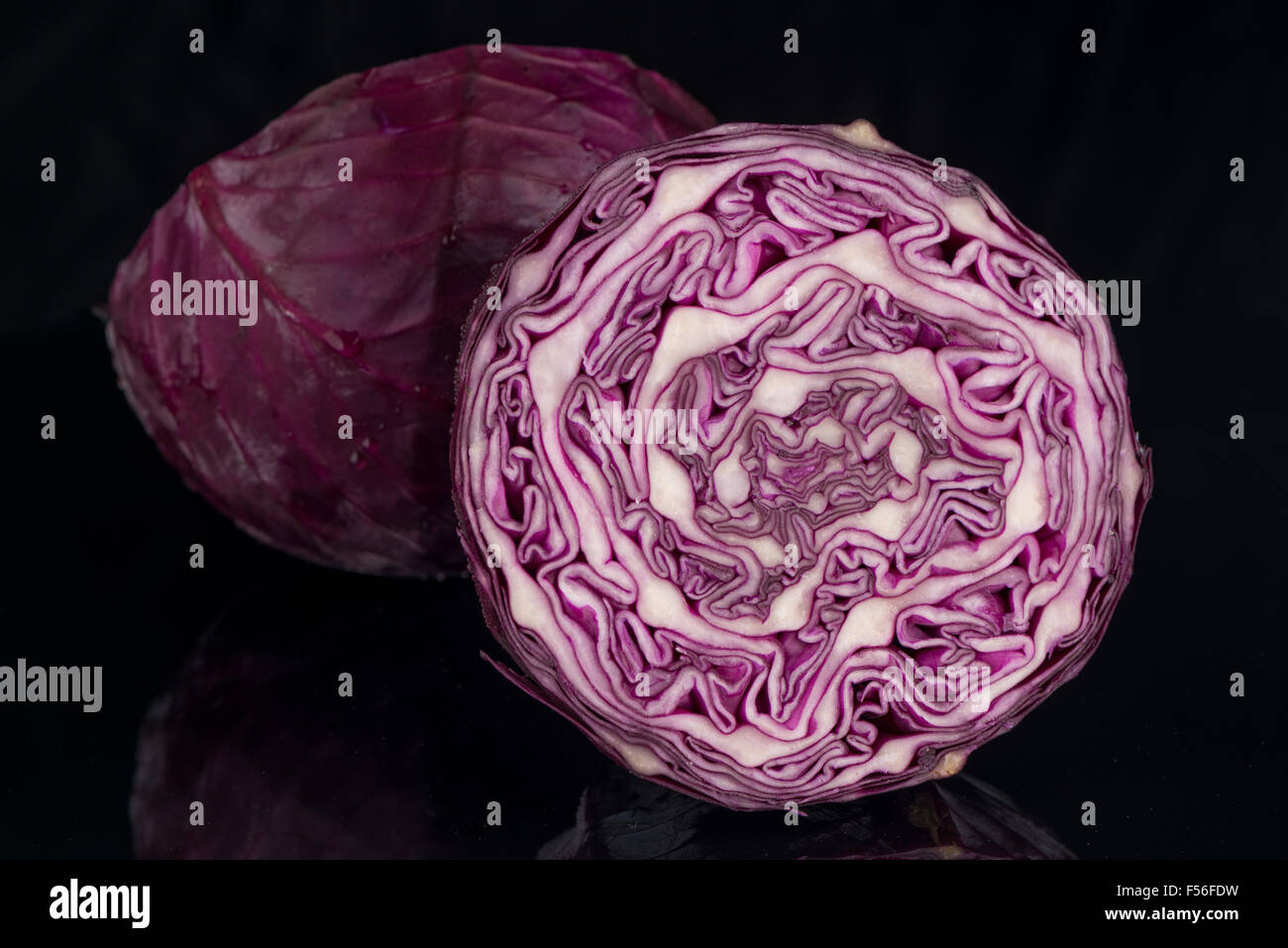 Red cabbage over black background Stock Photo - Alamy