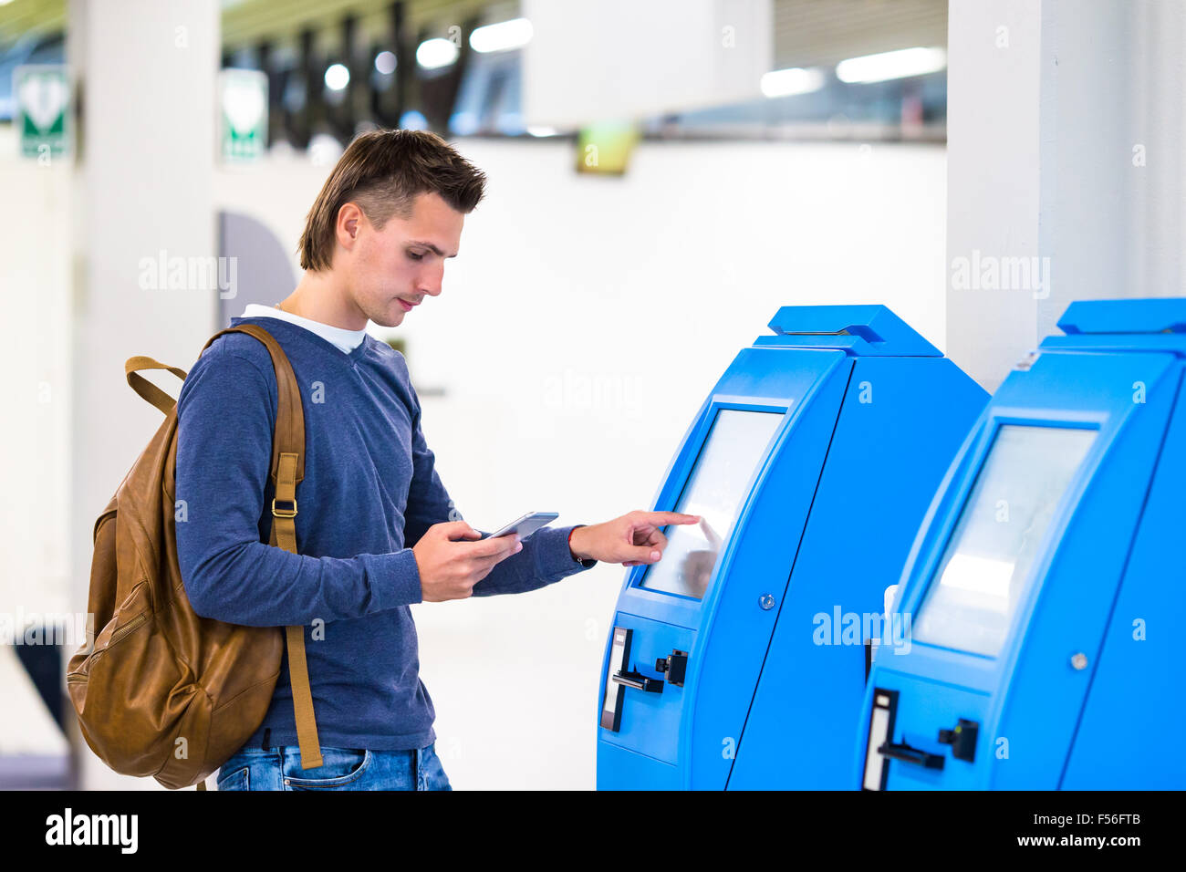 Display at self-service transfer machine, doing self-check-in for ...