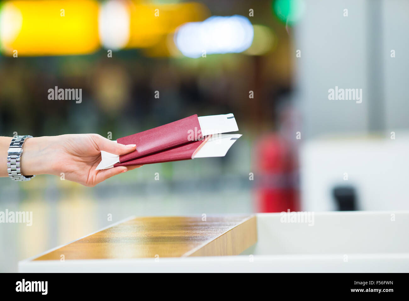 Closeup passports and boarding pass at the reception area in airport ...