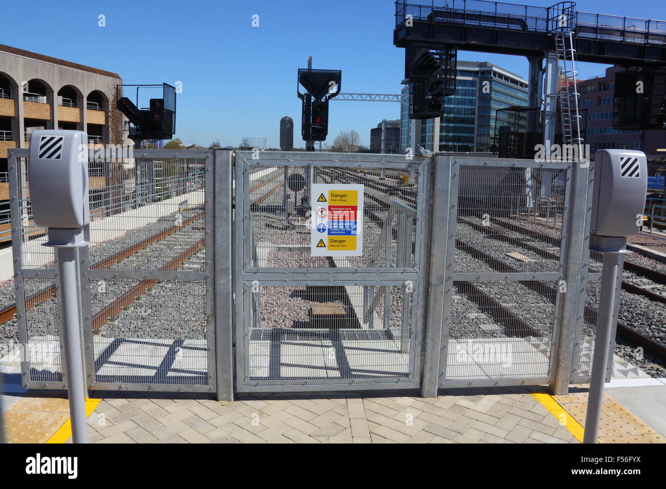 A new security fence on the end of a train station platform with a ...