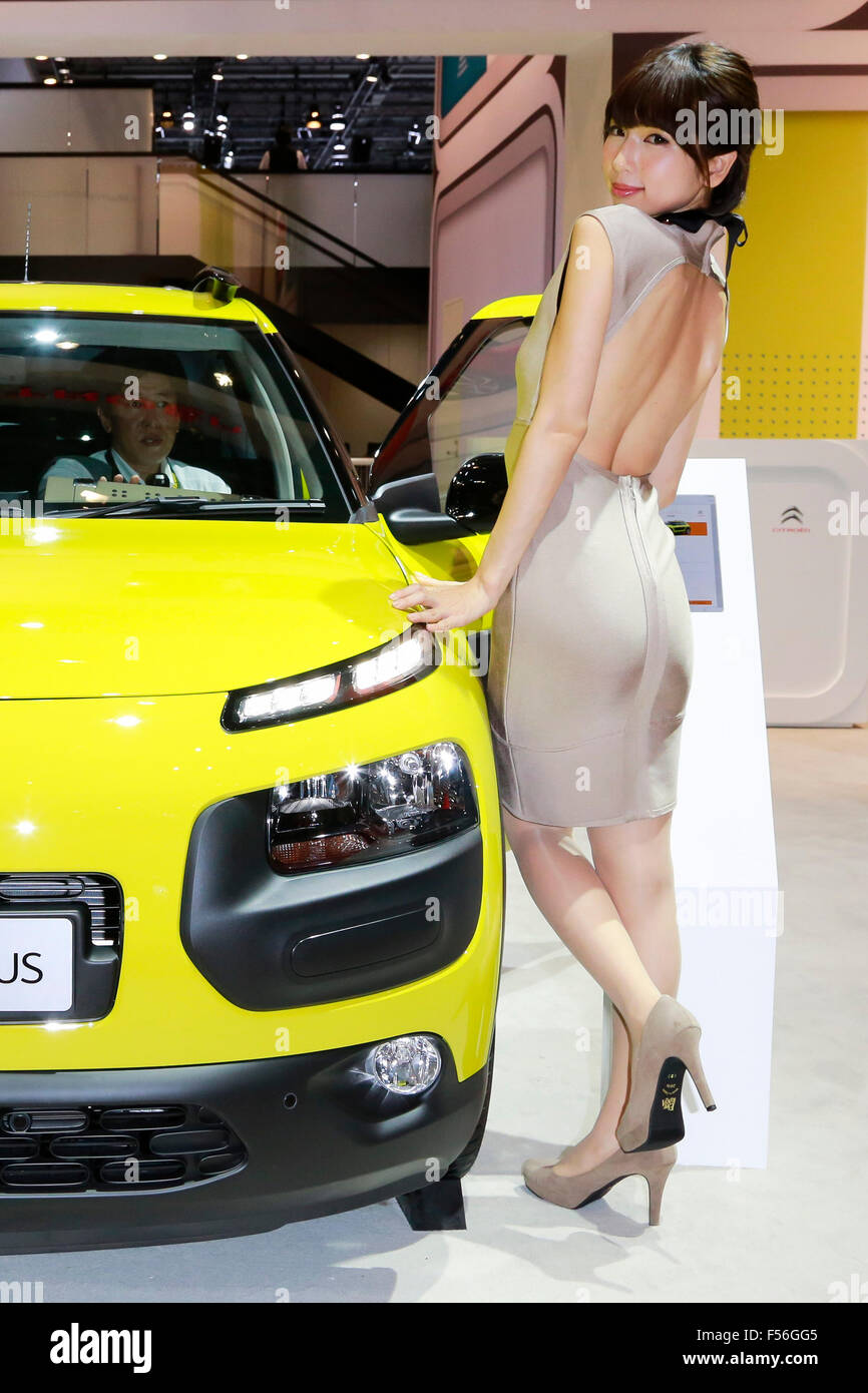 An exhibitor poses for the cameras during the 44th Tokyo Motor Show 2015 in Tokyo Big Sight on ...