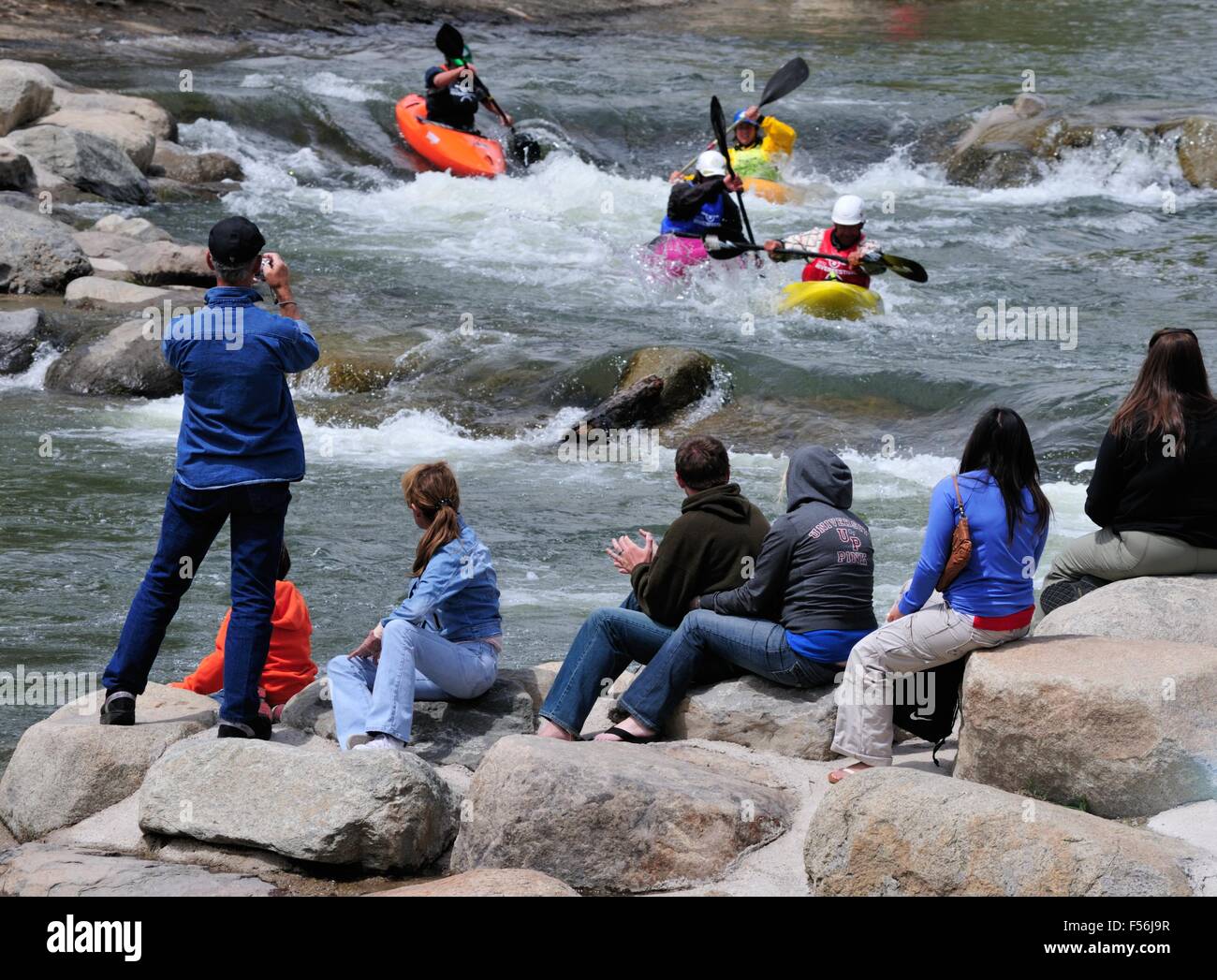Spectators watch intently as boatercross contestants vie for the lead ...