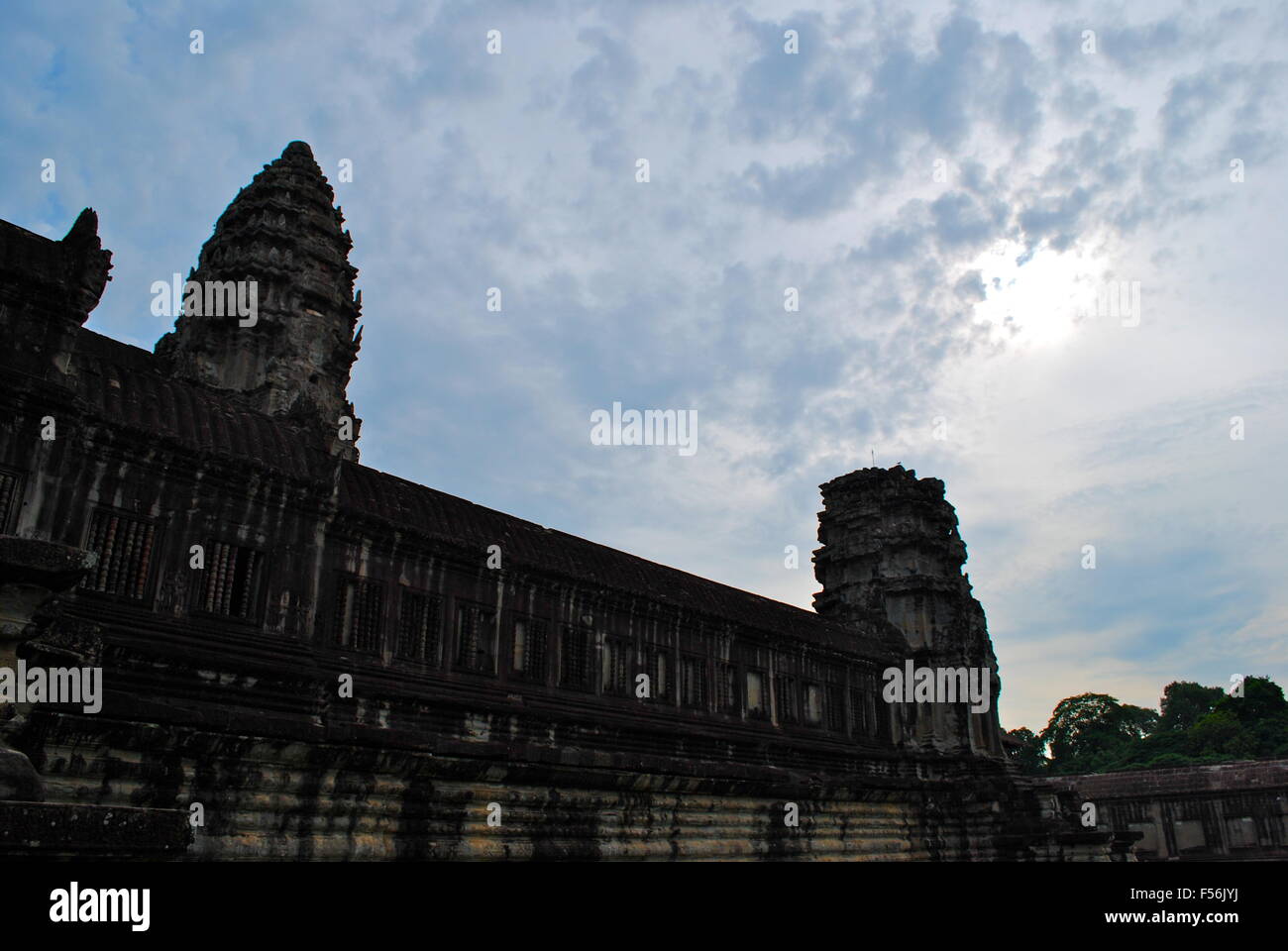 Angkor Wat temple in silhouette as the sun rises behind clouds Stock ...