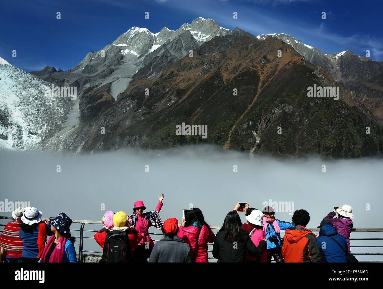 Kangding. 28th Oct, 2015. Tourists take photos in Hailuogou National ...