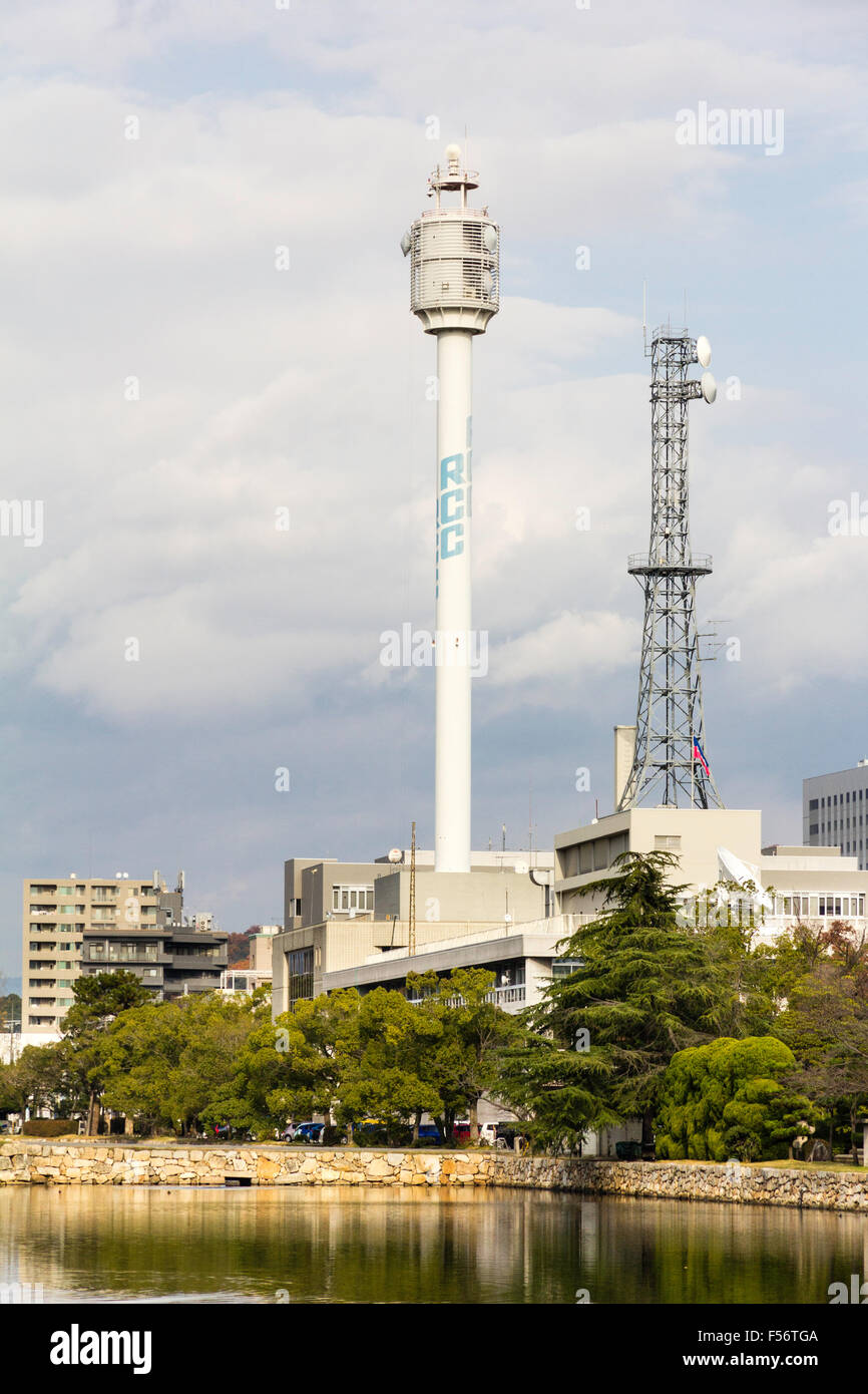 Japan, Hiroshima. Two TV and telecommunications towers in the city with ...