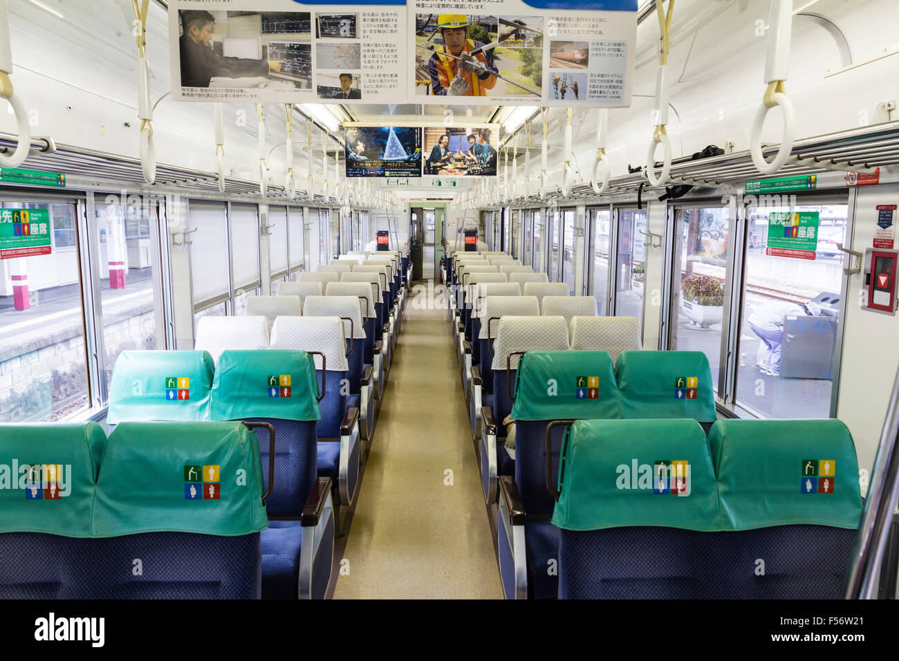 Japanese railways. Interior view commuter railway carriage with ...
