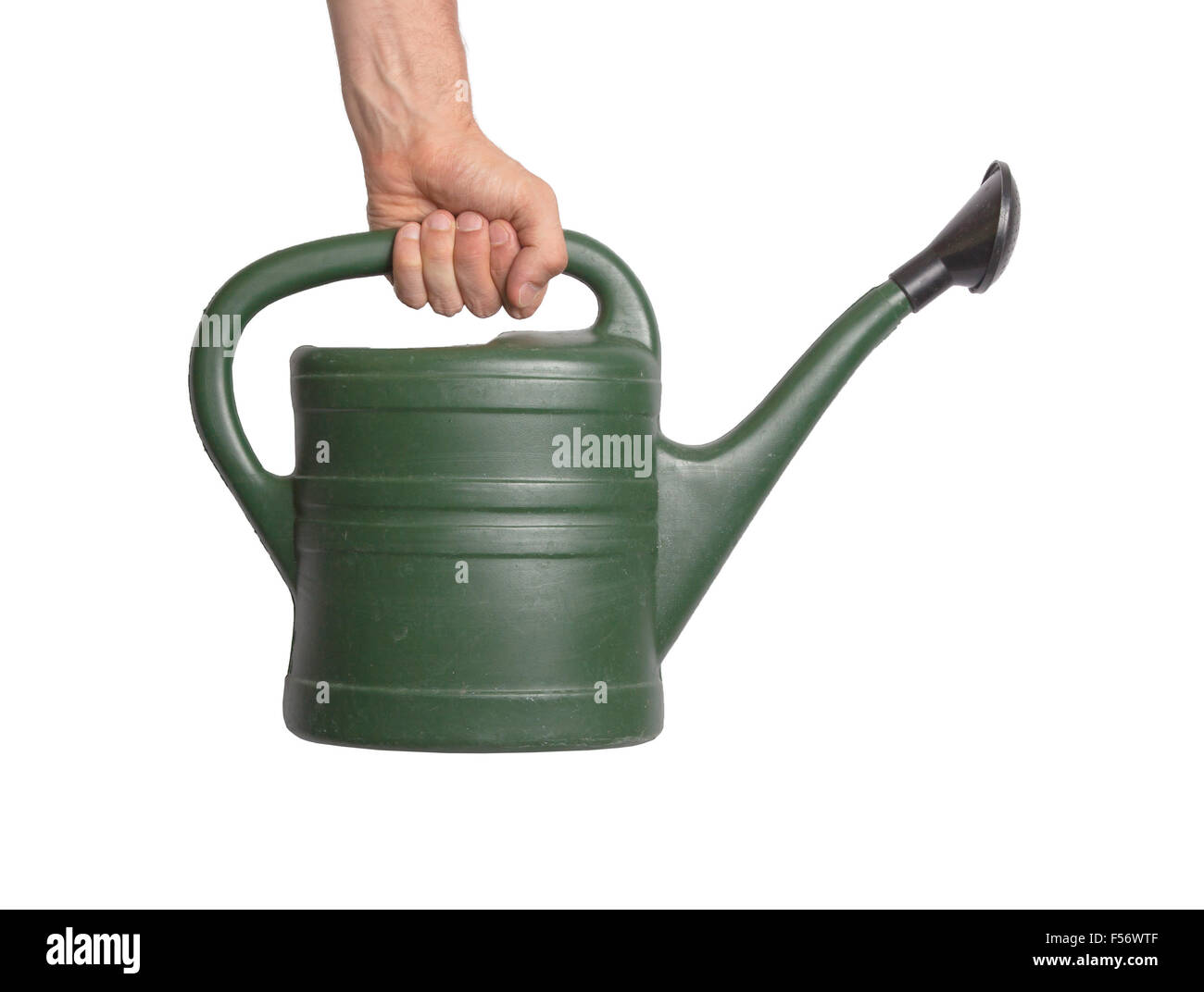 Hand holding green watering can, isolated on white Stock Photo - Alamy
