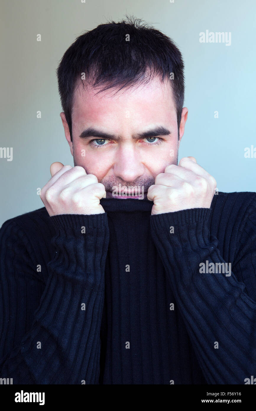 portrait of handsome man in black sweater Stock Photo - Alamy