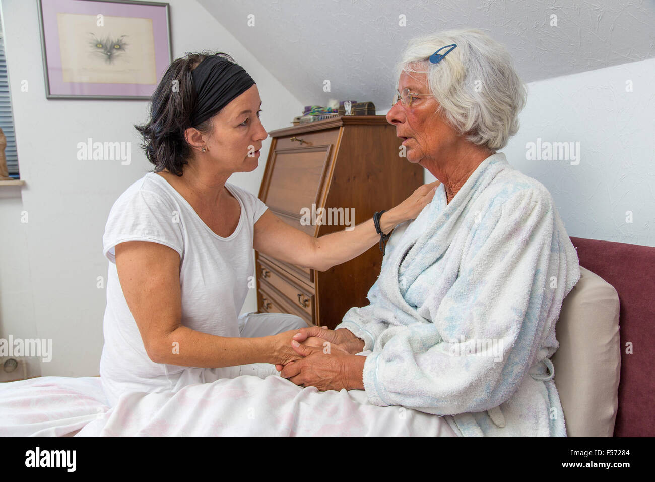 Elderly care at home, Nurse cares for an elderly woman, talking ...