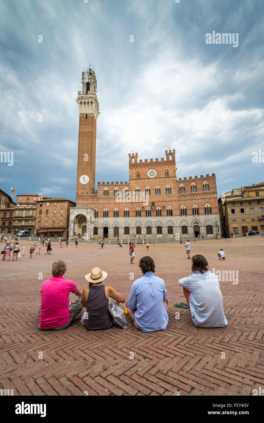 The Campo Square with Mangia Tower the landmark of Siena, Italy Stock ...