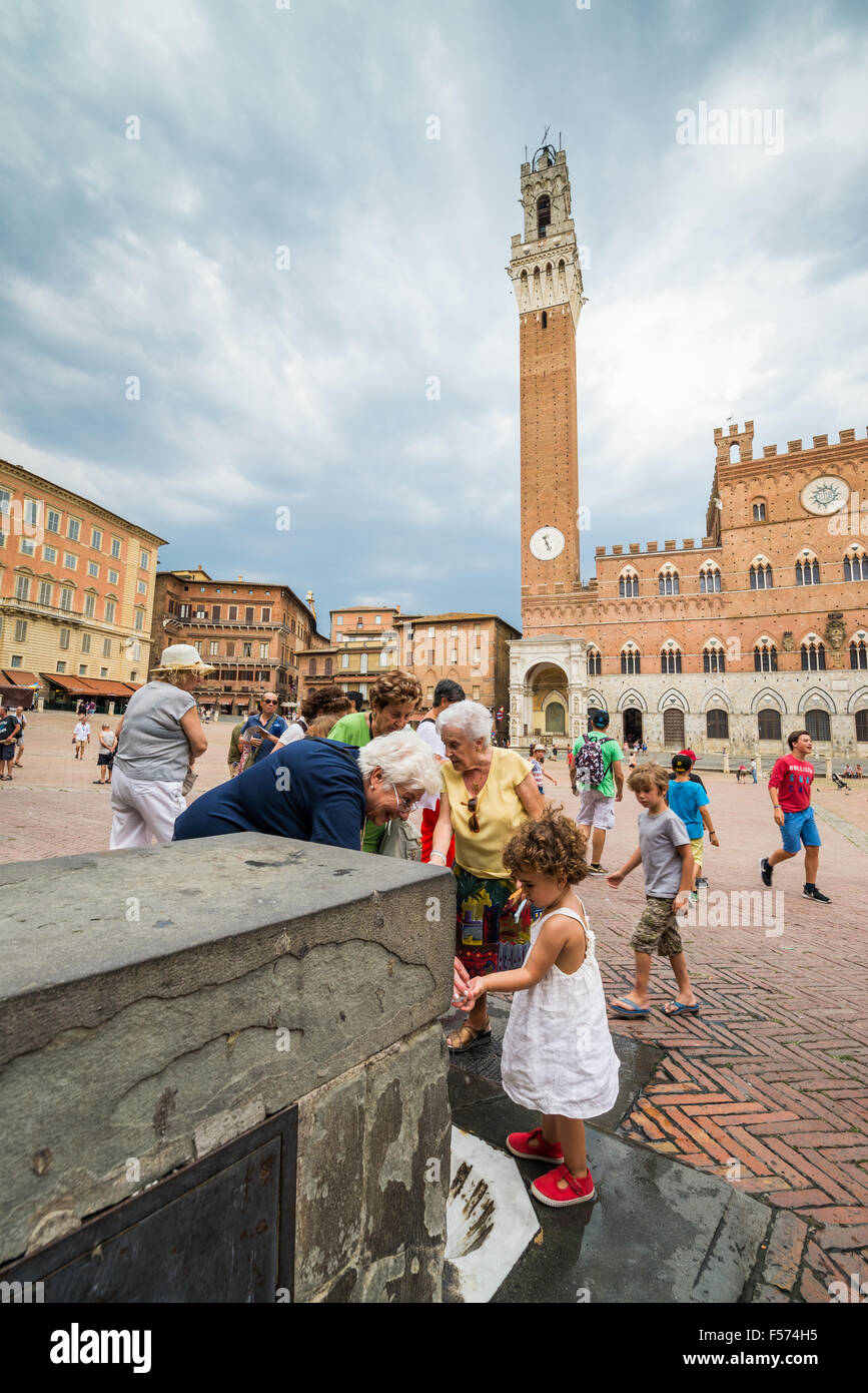 The Campo Square with Mangia Tower the landmark of Siena, Italy Stock ...
