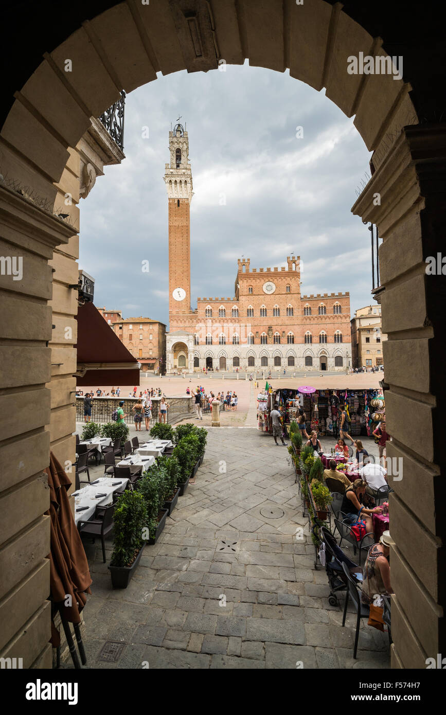 The Campo Square with Mangia Tower the landmark of Siena, Italy Stock ...