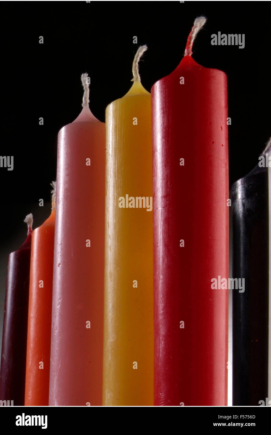 group of colorful cylindrical candles on a black background Stock Photo ...