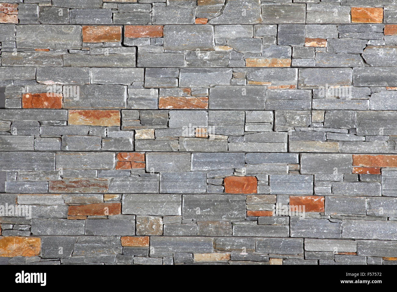 red and grey brick wall for decoration engineering Stock Photo - Alamy