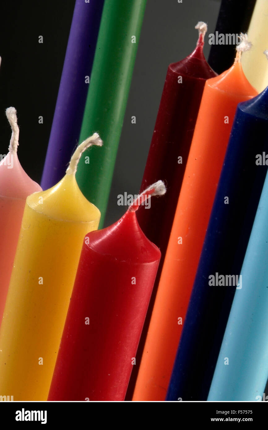 group of colorful cylindrical candles on a black background Stock Photo ...